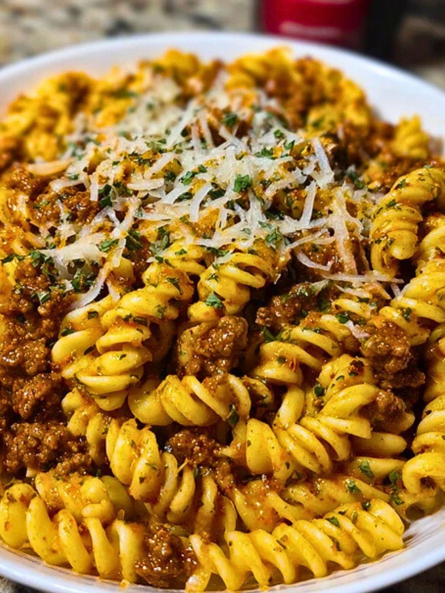 Cheesy Garlic Twisted Pasta with Cajun Ground Beef and Alfredo Velveeta